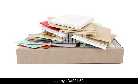Stack of different paper envelopes and parcel on white background. Post ...