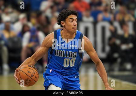 Dallas Mavericks guard Max Christie (00) fouls Washington Wizards guard ...