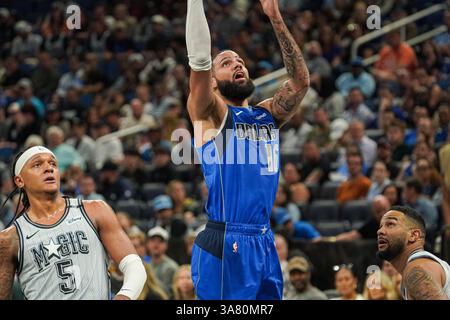 Dallas Mavericks forward Caleb Martin, left, defends against Sacramento ...
