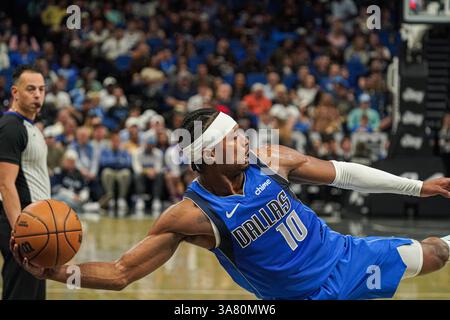 Dallas Mavericks guard Brandon Williams (10) shakes hands with a young ...