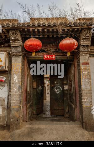 Chinese Entrance with Stone Columns and Wooden Door Stock Photo - Alamy