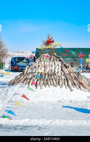 Pyramid of Fish on Snow with Colorful Flags Stock Photo - Alamy