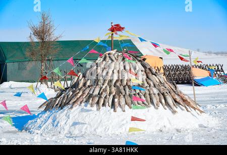 Pyramid of Fish on Snow with Colorful Flags Stock Photo - Alamy