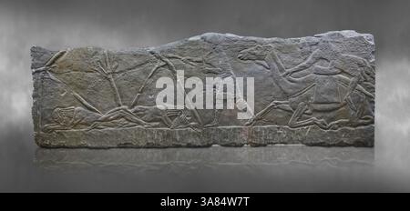 Ancient wall with bas-relief with assyrian warriors with spears ...