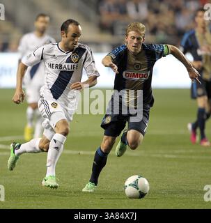 Philadelphia Union's Brian Carroll, right, defends Los Angeles Galaxy's ...