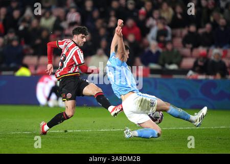 Sheffield United's Tom Cannon (left) and Burnley's Zian Flemming battle ...