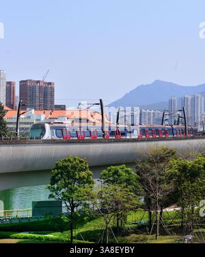 Train running on bridge alongside Shatin River Stock Photo - Alamy