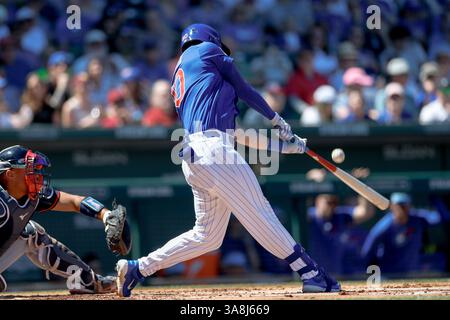 Chicago Cubs' Kyle Tucker (30), right, high fives Ian Happ after Tucker ...