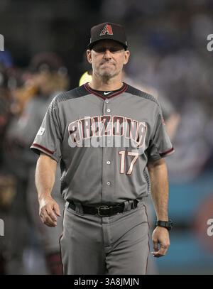 Arizona Diamondbacks manager Torey Lovullo, right, talks with umpire ...