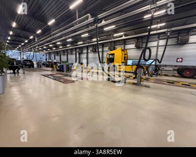 Different cars undergoing procedure of vehicle inspection at station ...