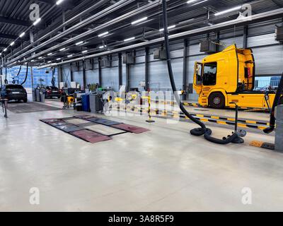 Different cars undergoing procedure of vehicle inspection at station ...