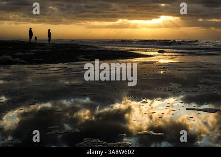 Isle Of Palms, United States. 29 May, 2026. Beachgoers silhouetted by ...
