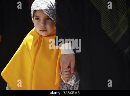 Budgam, India. 28th Mar, 2025. Kashmiri Shiite protesters are seen with ...