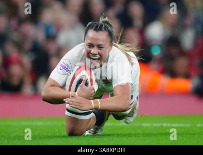 England’s Maddie Feaunati scores their first try of the game during the ...
