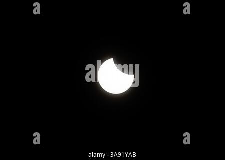 Partial Solar Eclipse seen over London as the moon passes between the ...