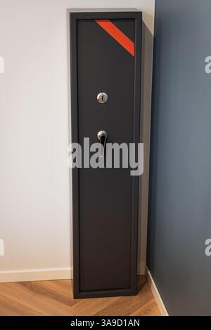 Firearms safe for long-barreled weapons in an apartment Stock Photo - Alamy