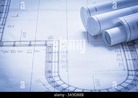 Rolled up blueprint rolls construction concept Stock Photo - Alamy
