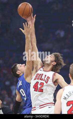 Chicago Bulls' Robin Lopez (42) attempts a shot in front of Orlando ...