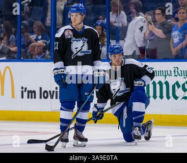Tampa Bay Lightning center Jake Guentzel (59) controls the puck on an ...
