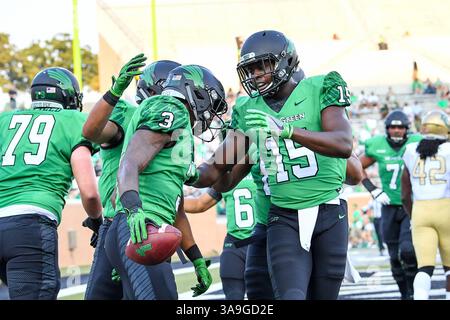 North Texas running back Caleb Hawkins (24) is pursued by South Florida ...