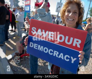 Protesters with placards deriding Elon Musk and Trump Administration's ...