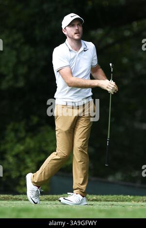 Russell Henley watches his tee shot on the 12th hole during the first ...