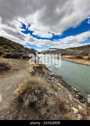 View from the water showing the rugged limestone cliffs and rocky ...