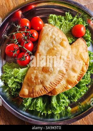 Appetizing meat pie or chebureks Stock Photo - Alamy