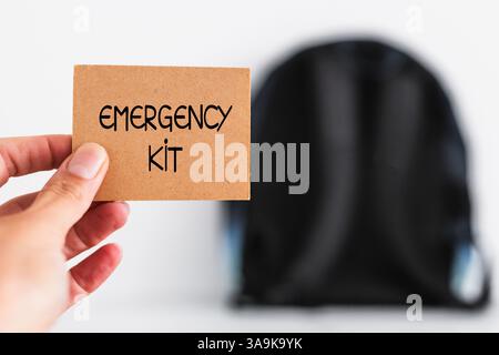 emergency survival kit for 72h, sign with backpack shot at shallow ...