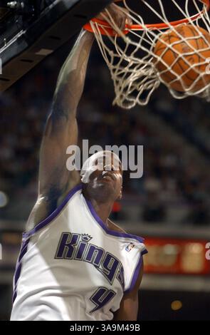 Chris Webber, #4, of the Sacramento Kings dunks one on Portland Trail ...