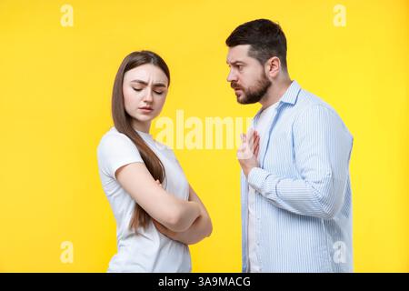 Angry couple arguing on yellow background. Relationship problem Stock ...