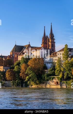 Basel Munster in the river Rhine, at the autumn fair with the ferris ...