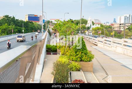 Environmentally friendly,elevated walkway with many plants and flowers ...