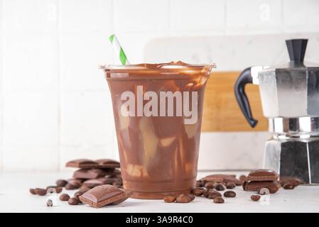 Viral Cracking Chocolate Latte drink. Plastic glass with cracked milk ...