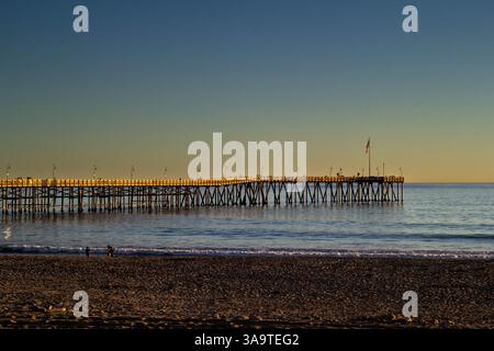 Wooden pier at sunset. Seascape with sunset lights Stock Photo - Alamy