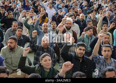 Iranian worshippers chant slogans during Friday prayers ceremony at the ...