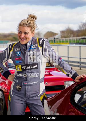 Female racing car driver Jade Edwards sitting in a Ford Capri racing ...