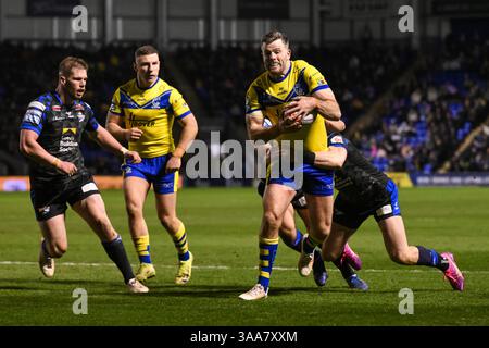 Warrington Wolves' Lachlan Fitzgibbon is tackled by Leigh Leopards ...