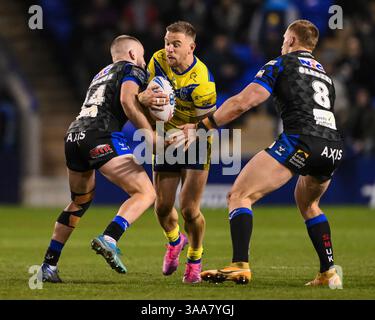 Matt Dufty of Warrington Wolves is tackled during the Betfred Super ...