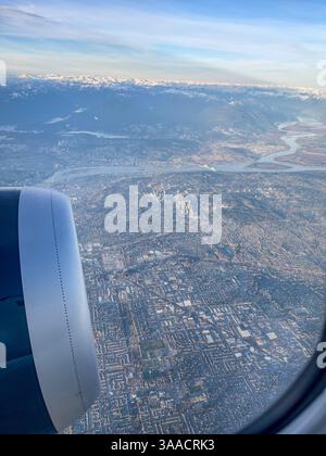 View from airplane window featuring aircraft wing flying above dramatic ...