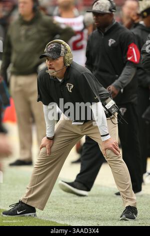 Atlanta Falcons coach Dan Quinn catches a ball during an NFL football ...
