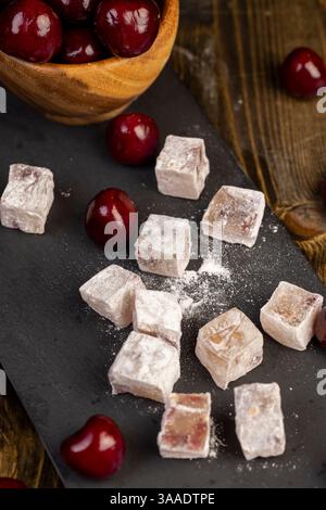 Bowl with turkish delight cubes on white textured background Stock ...