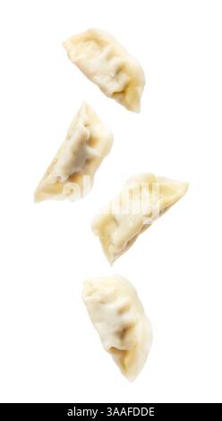 Tasty boiled gyoza (dumplings) falling on white background Stock Photo ...