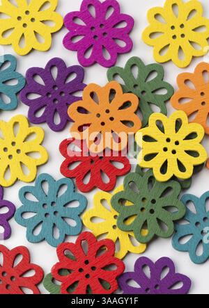 Many bright multi-colored objects printed on 3d printer lie on flat ...