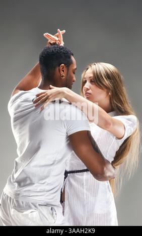 Young couple dances Caribbean Salsa, studio shot Stock Photo - Alamy