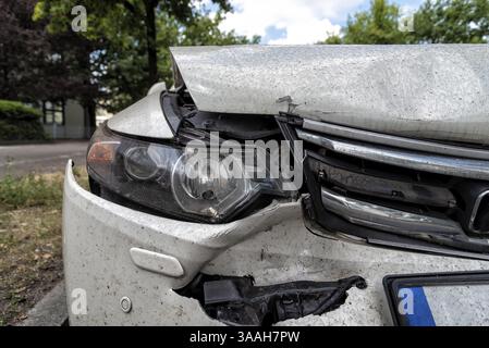 Badly damaged car on the side of the road after an accident Stock Photo ...