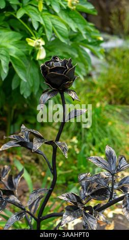 Forged metal roses in park by pond on embankment of Iset River ...