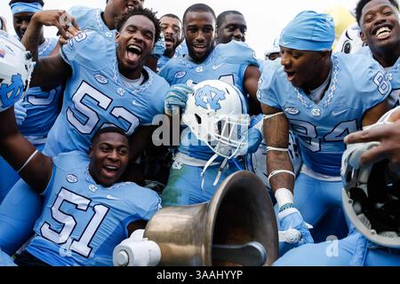 Duke players ring the Victory Bell after defeating North Carolina in an ...