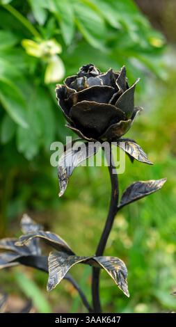 Forged metal roses in park by pond on embankment of Iset River ...