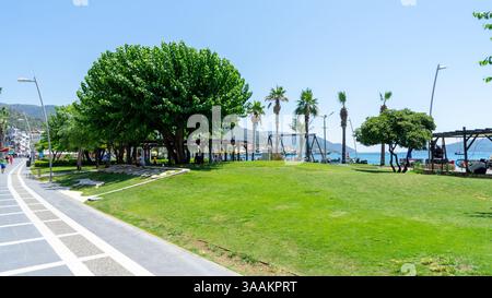 Urban sandy beach in Marmaris, Turkey, on Mediterranean coast. Yachts ...